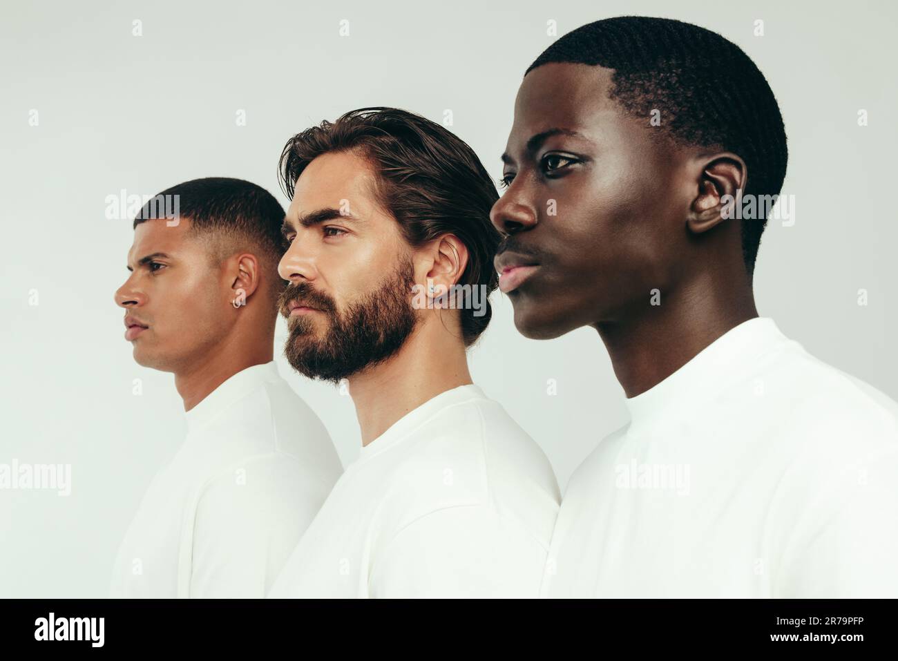 Three men with radiant and flawless skin standing side by side in a ...