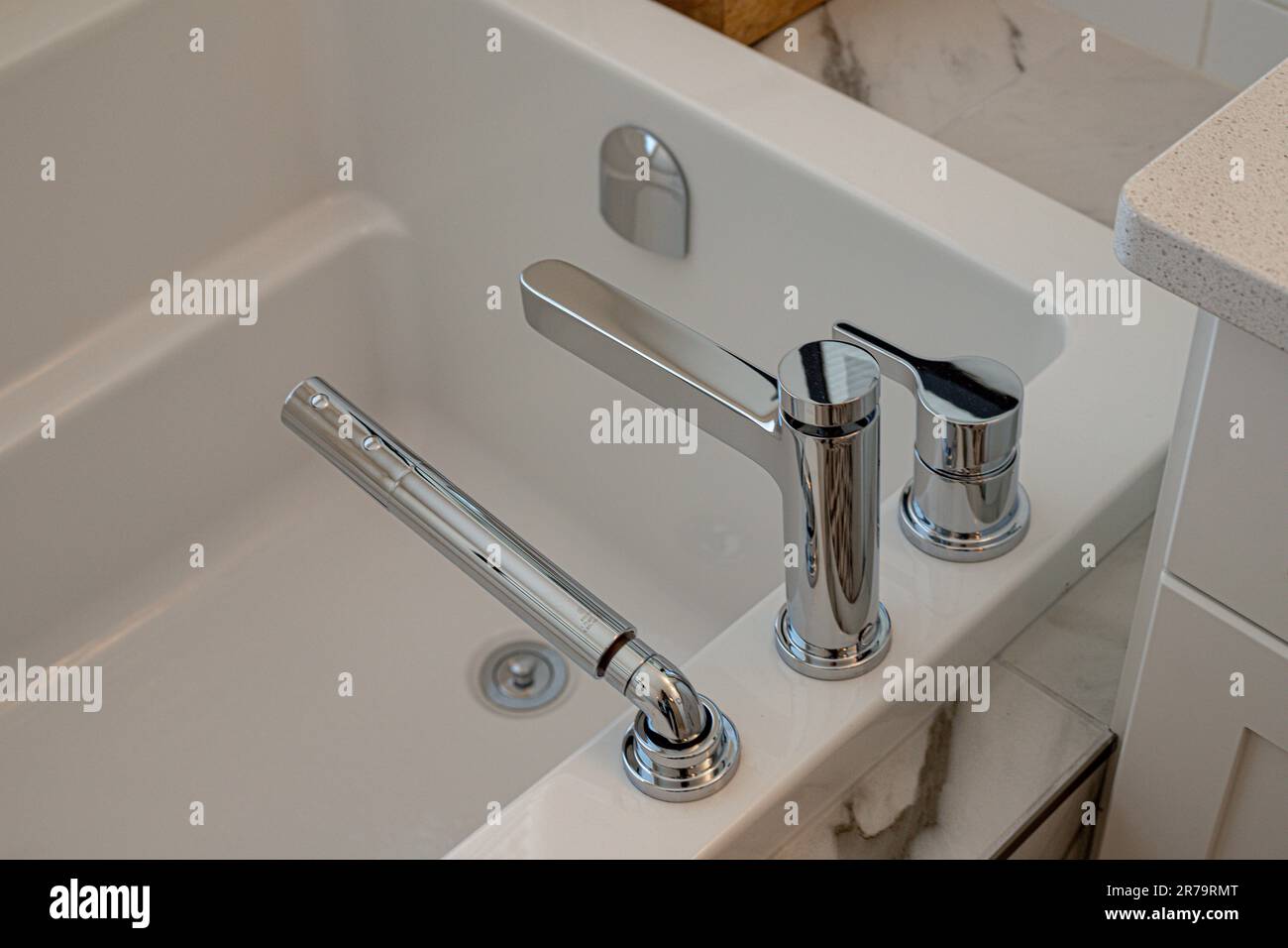 An interior design of a tap in a modern bathroom Stock Photo - Alamy