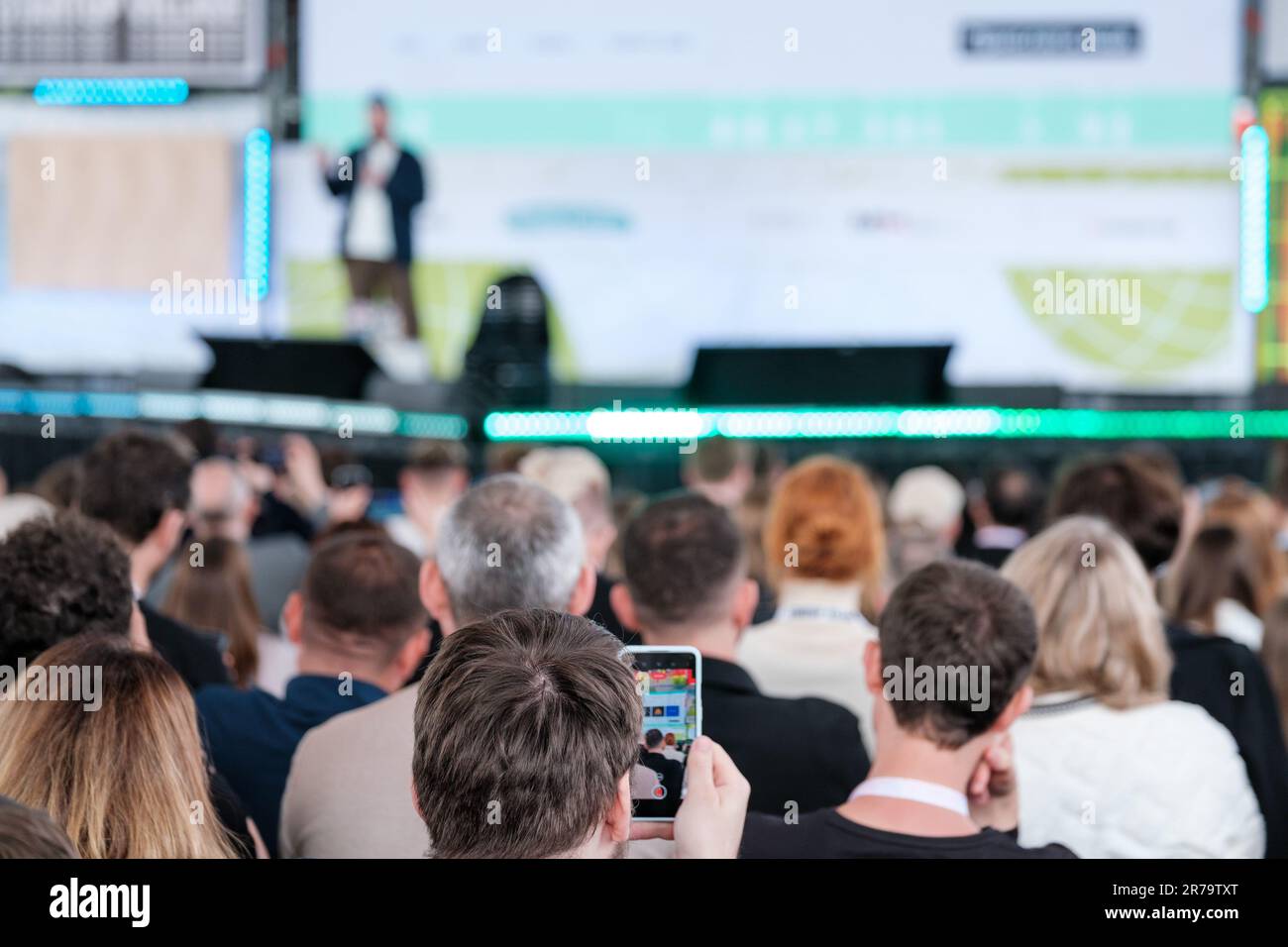 Back view of anonymous people gathering at conference Stock Photo - Alamy