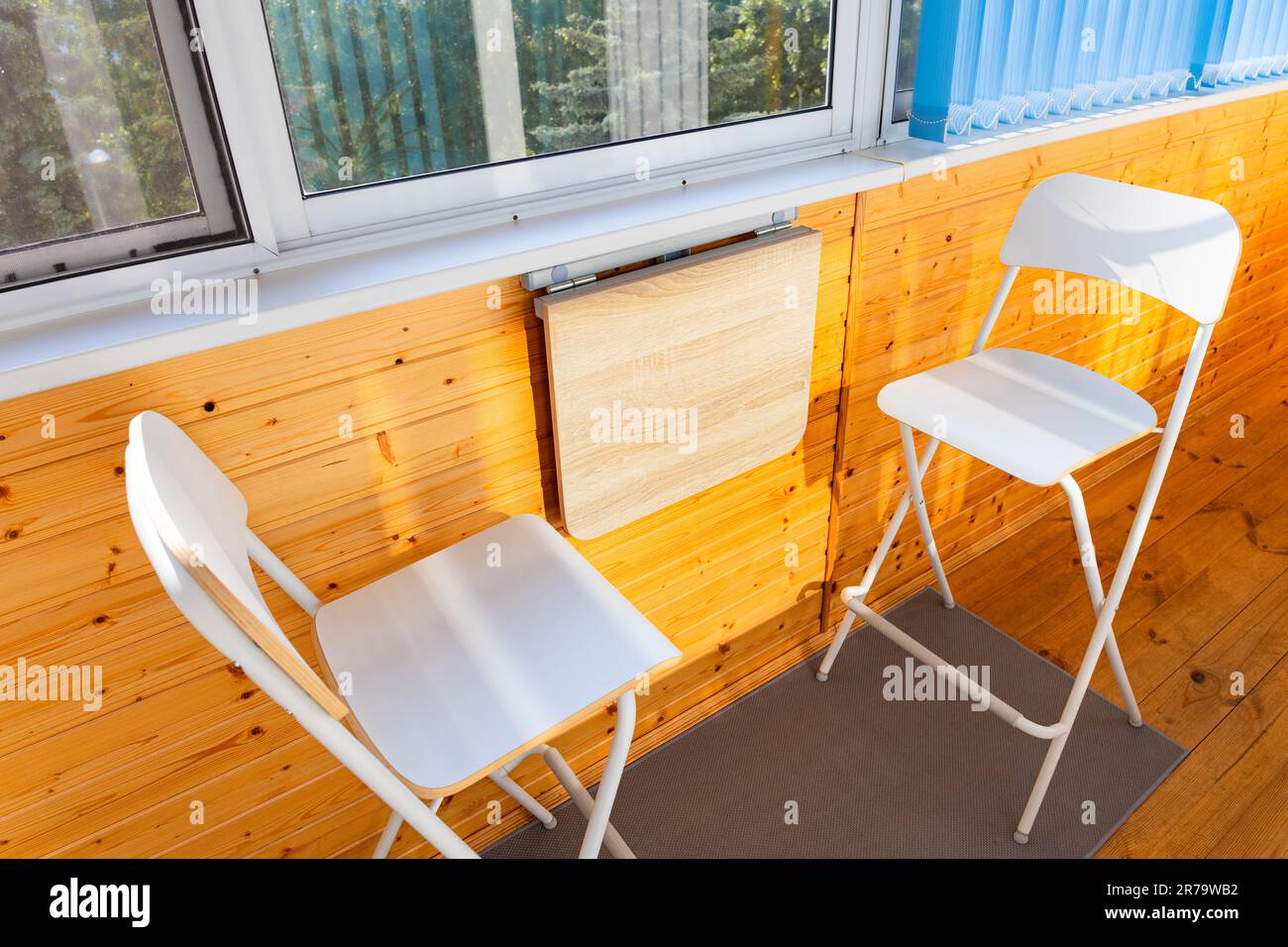 folding table in the closed position on the balcony. folding wooden ...