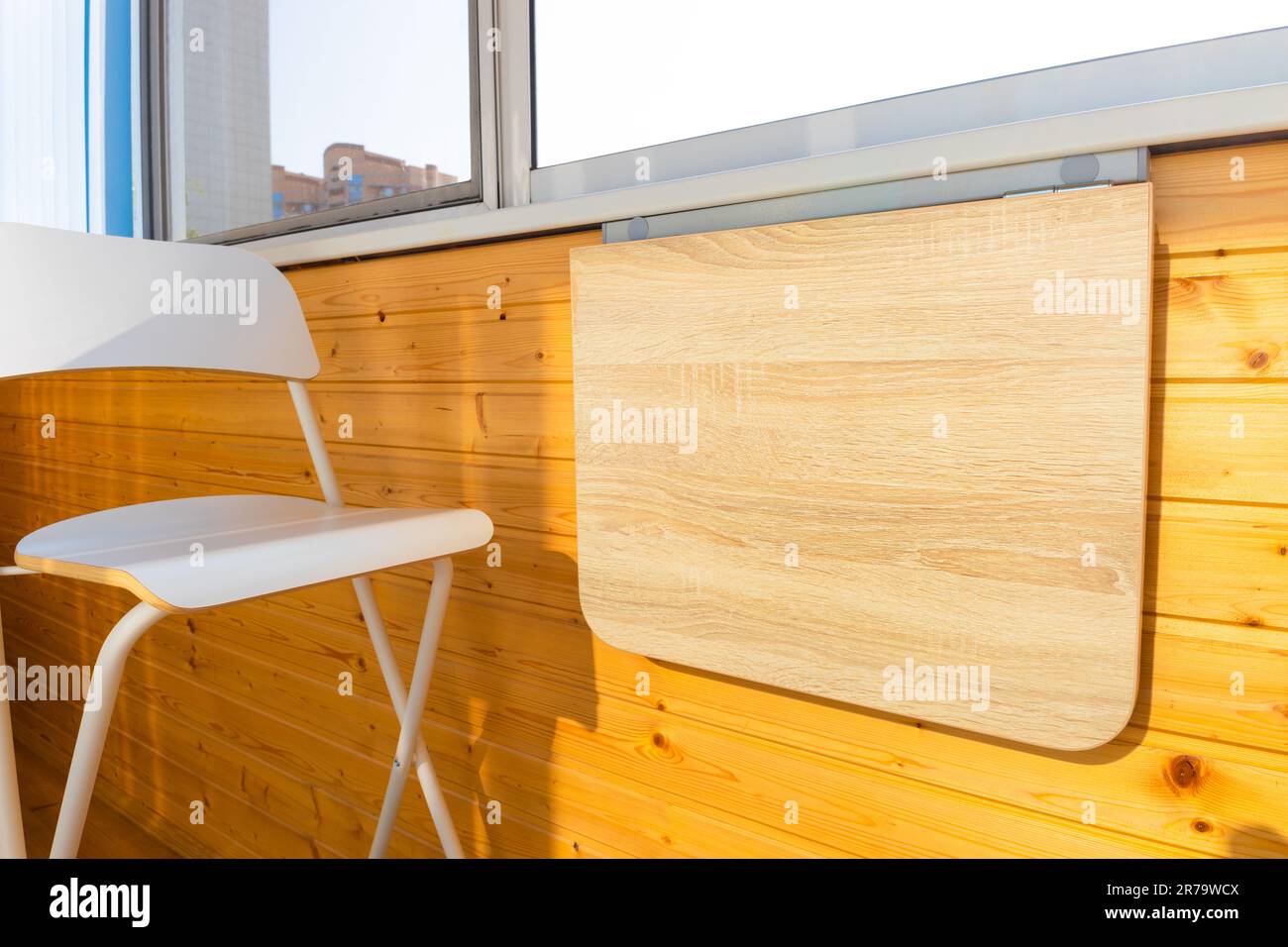 folding table in the closed position on the balcony. folding wooden ...