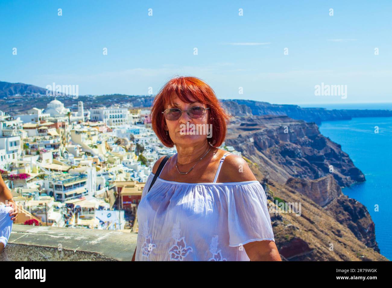 Beautiful mature 63 years old tanned red hair tourists woman standing ...