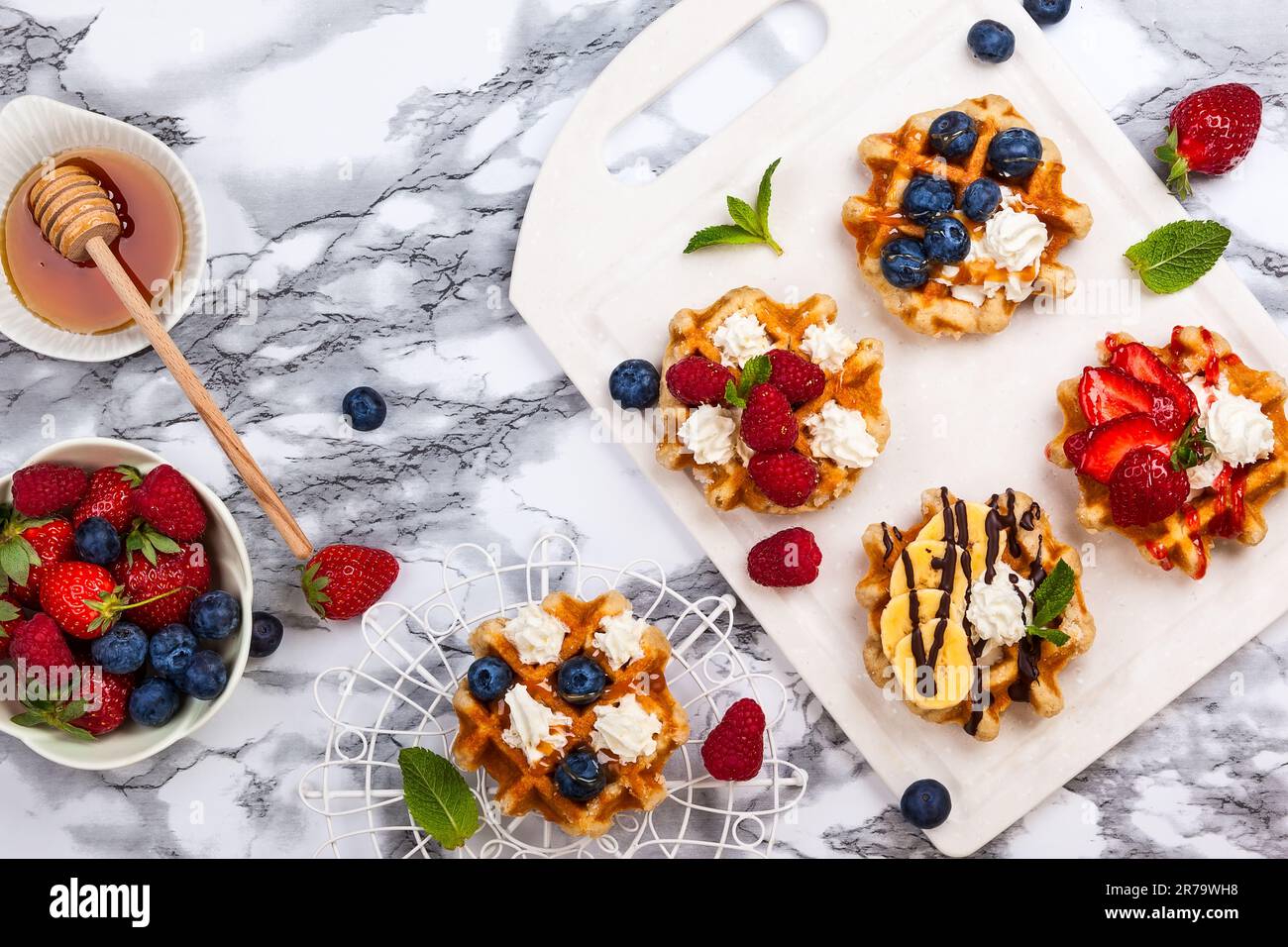 Delicious Belgian Waffles with berry, fruit, whipped cream and ...