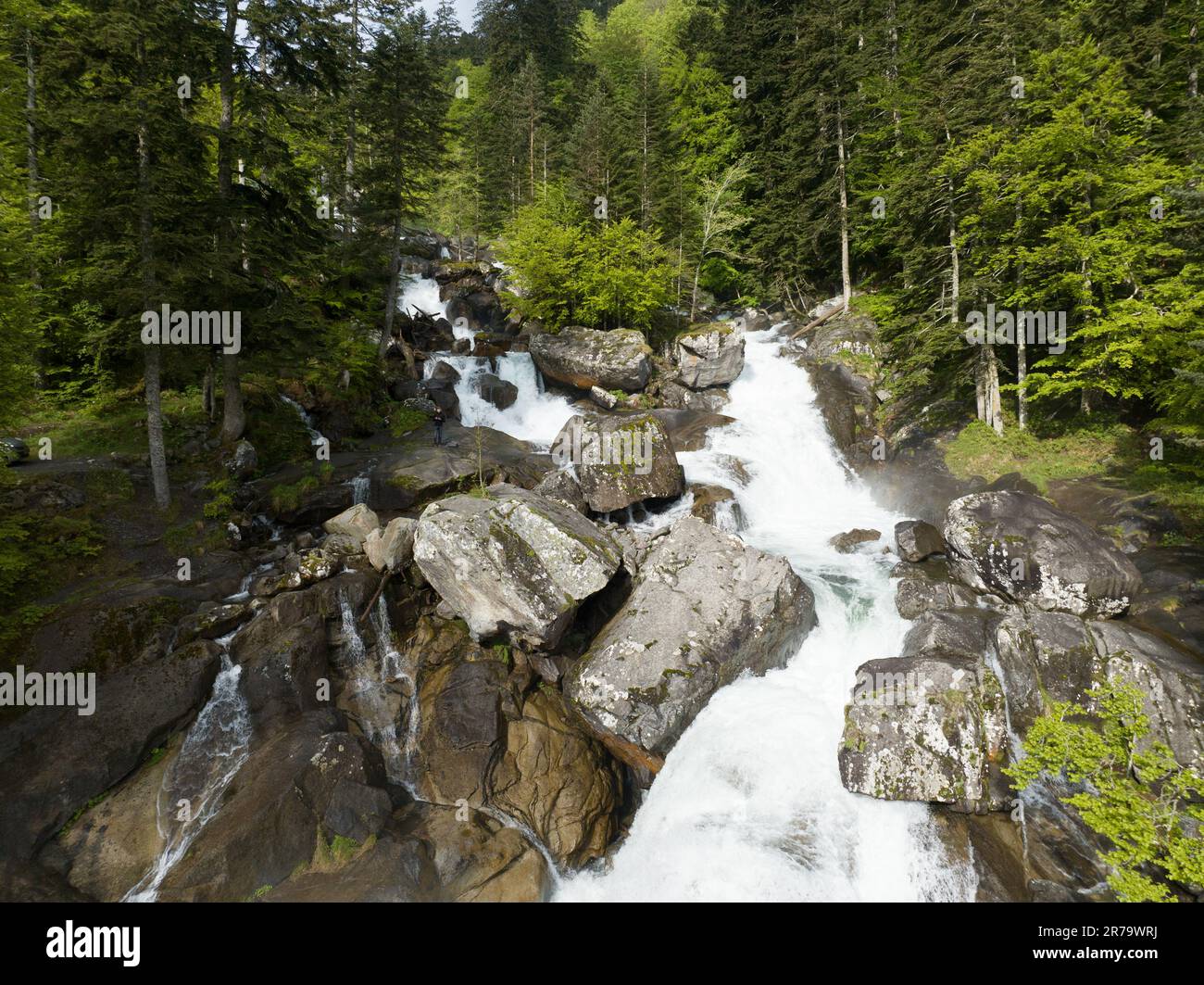Drone flying along a wild water waterfall in the French Pyrenees Stock ...