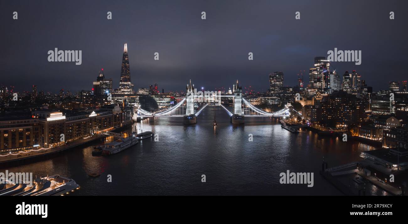 Aerial night view of the lifting up Tower Bridge in London Stock Photo ...