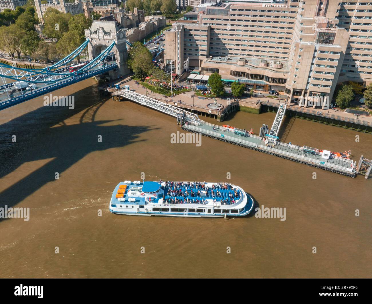 Tourist boat exploring London under the Tower Bridge Stock Photo - Alamy