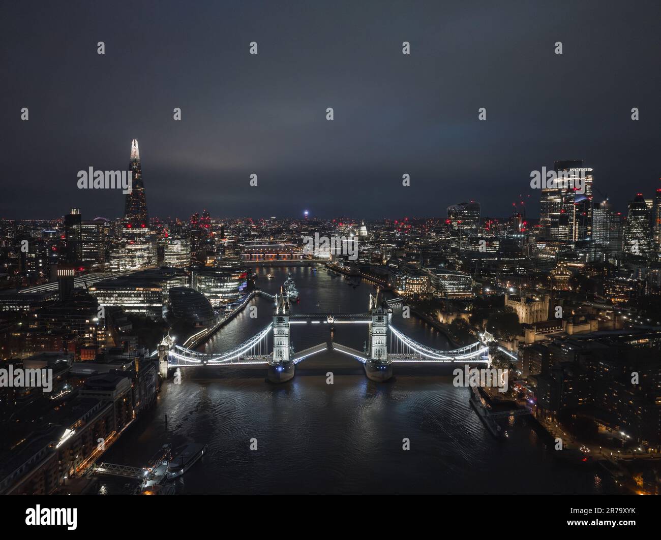 Aerial night view of the lifting up Tower Bridge in London Stock Photo ...