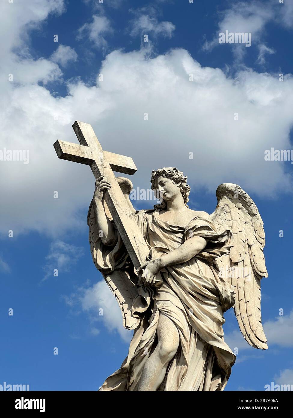 An Angel holding the Holy Cross statue on Holy Angel Bridge in Rome ...