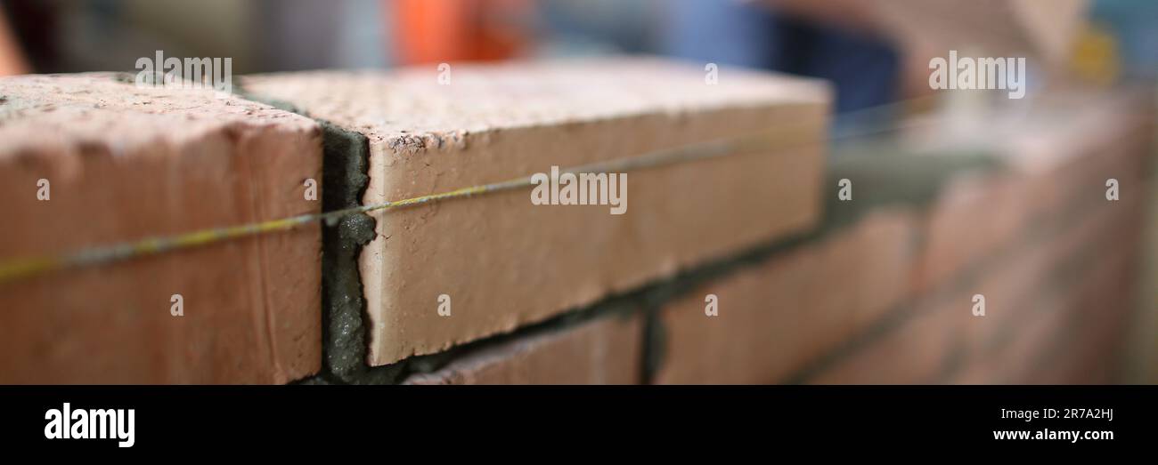 Master builder makes brickwork in house closeup Stock Photo - Alamy
