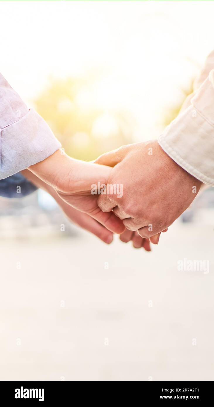 Beautiful close up photo of two unrecognisable people holding hands ...