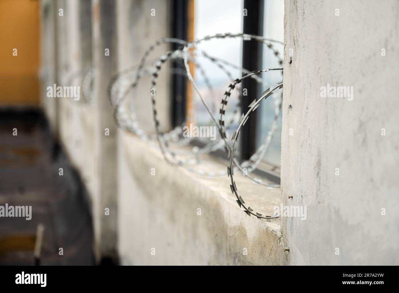 A protective fence to prevent climbing over the wall Stock Photo - Alamy