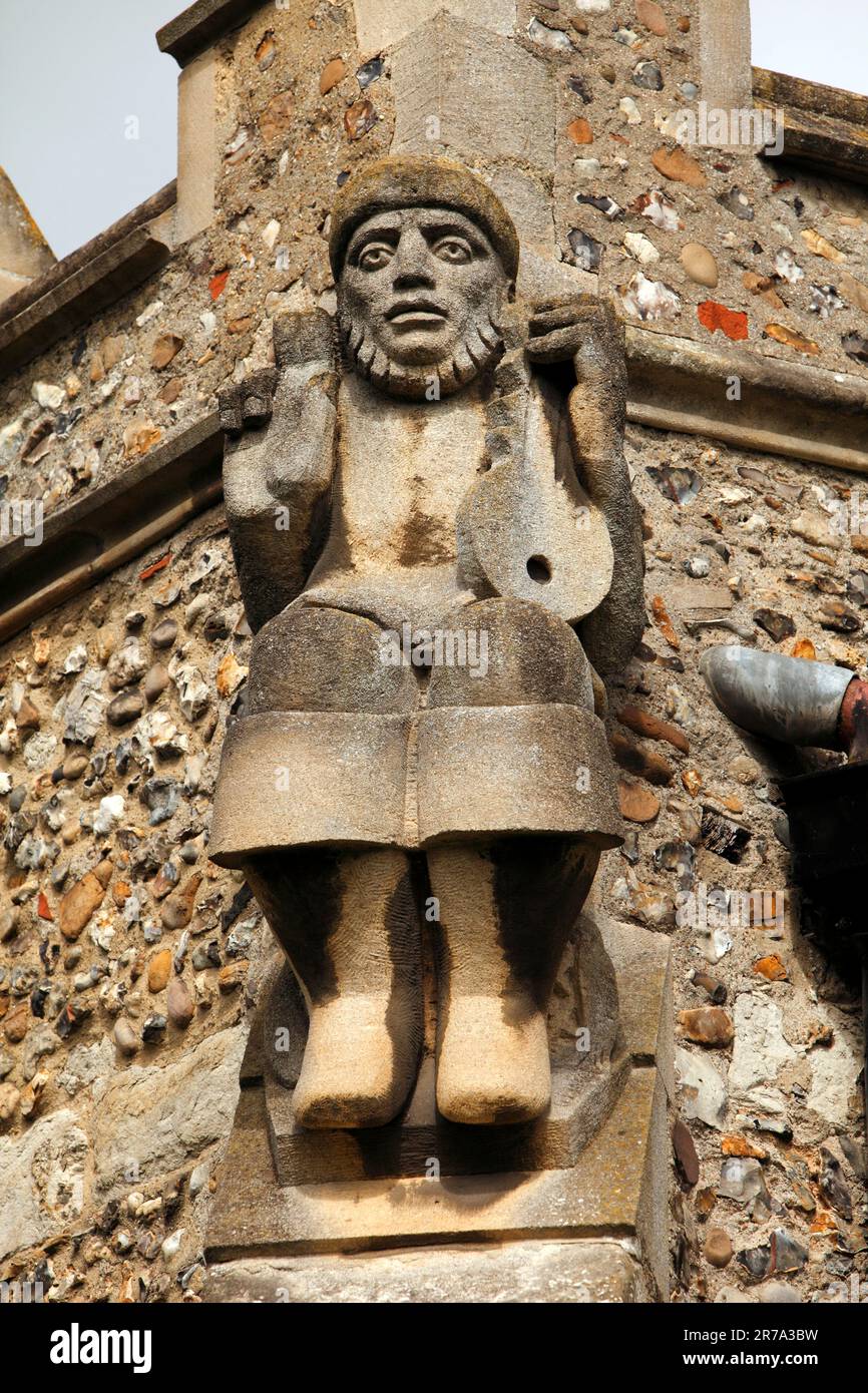 Contemporary statue of Saint Peter wearing fishing boots, holding the ...