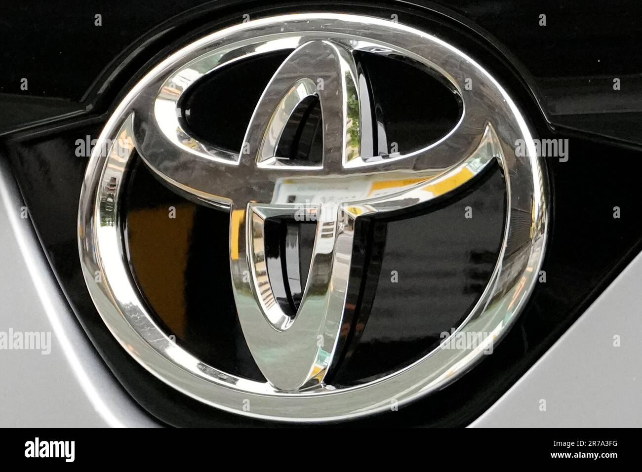 The logo of Toyota Motor Corp., is seen at a Toyota car in Yokohama ...