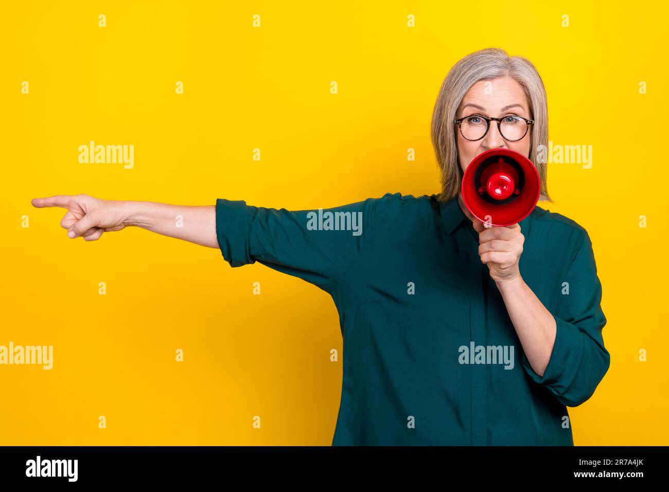 Photo of furious chief aged lady authority shouting in megaphone ...