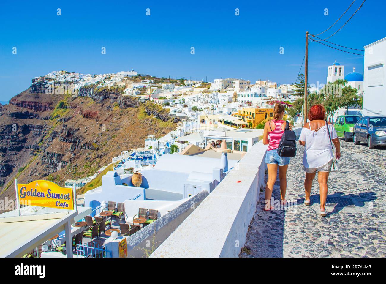 Women walking up the cobblestone stairs footpath overlooking the ...
