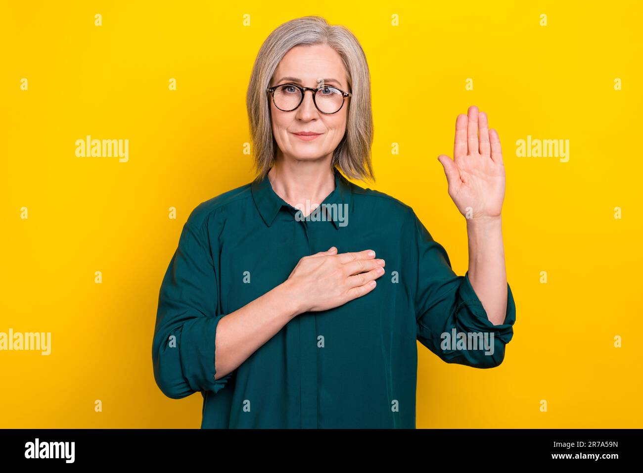 Portrait of candid focused aged person arm touch chest heart raise palm ...