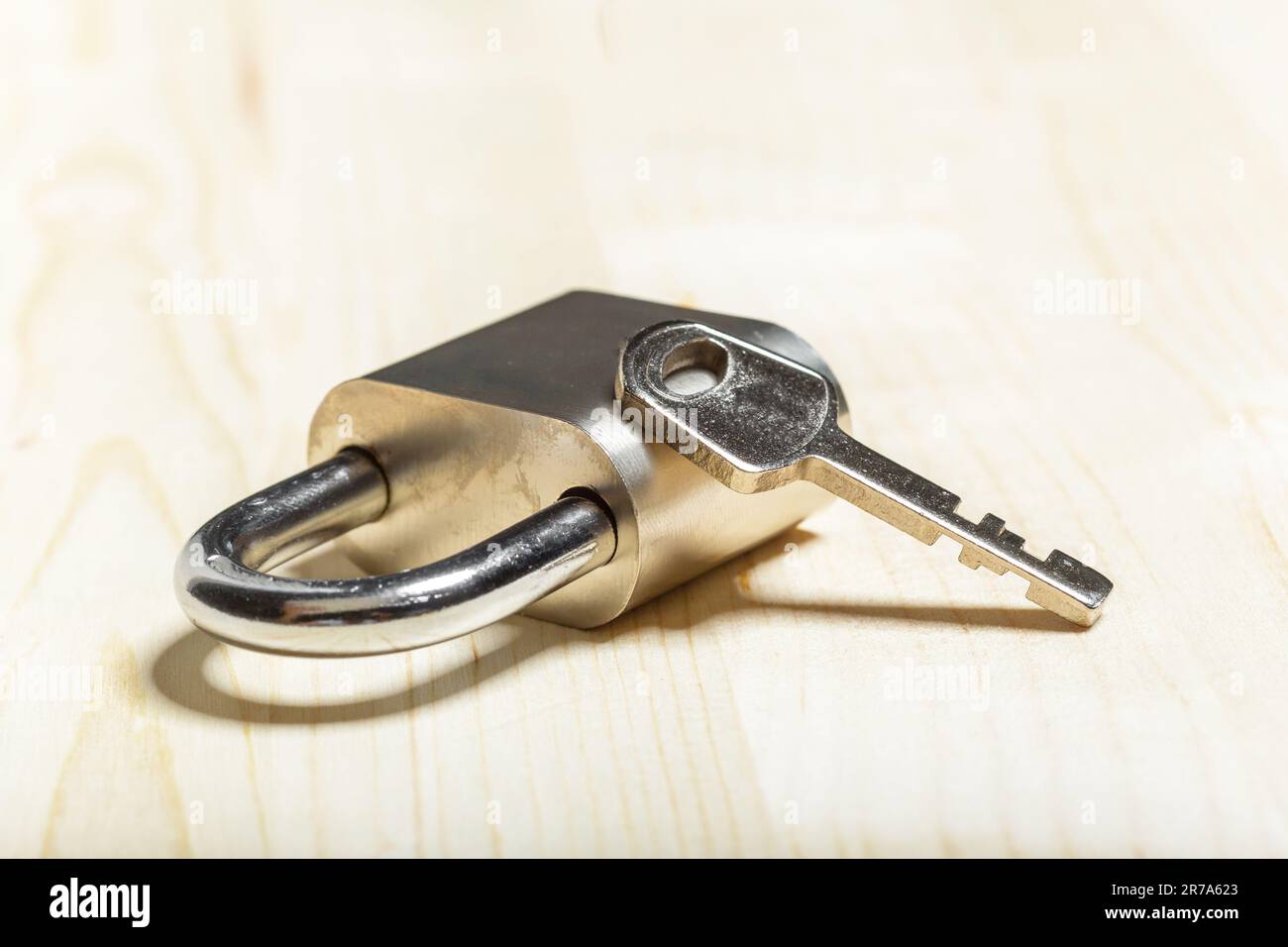 check-lock on the wooden table background Stock Photo - Alamy
