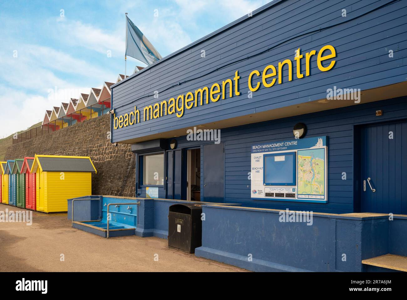 Beach Management Centre and brightly coloured beach huts on Whitby ...