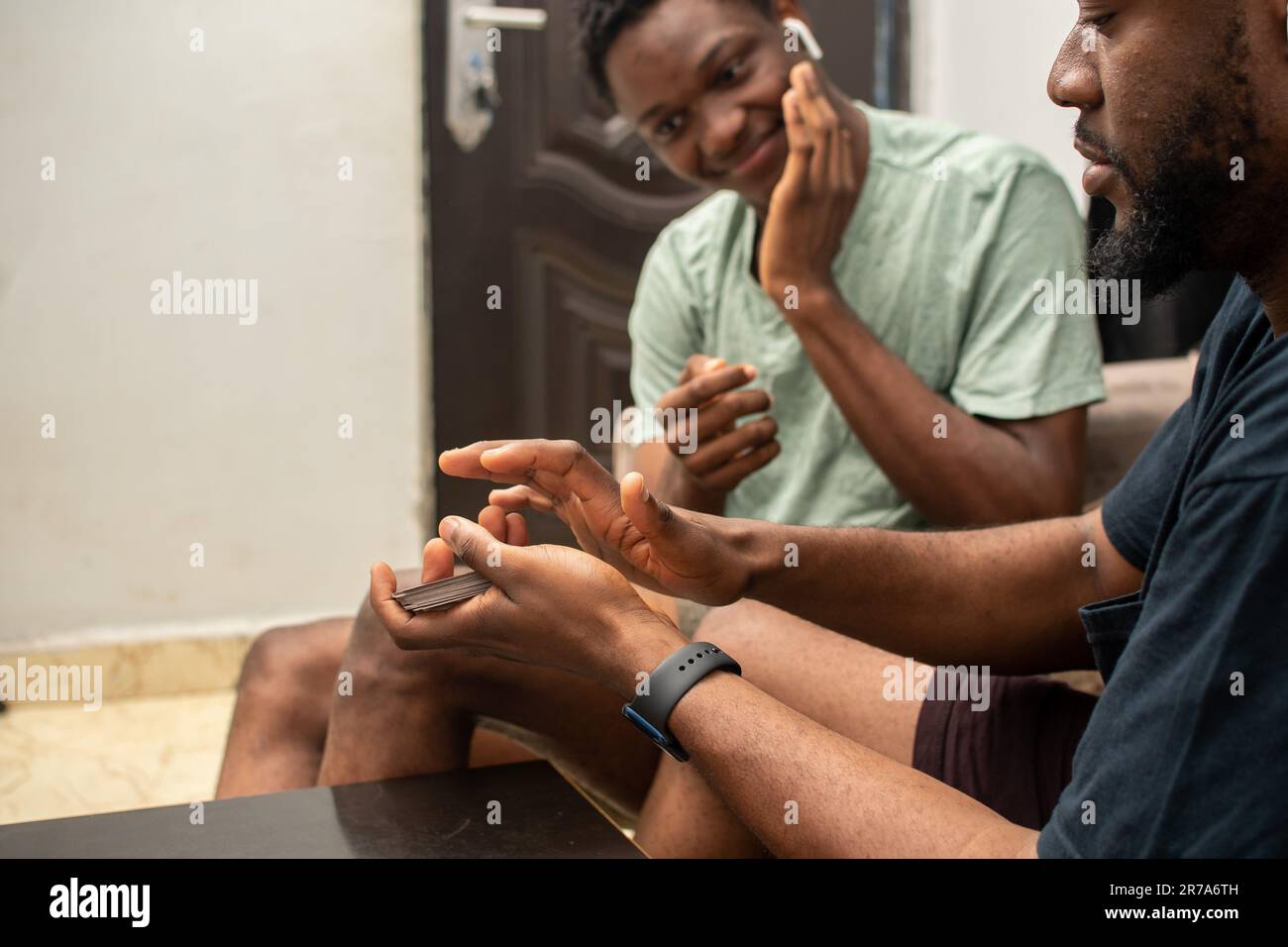 person shuffling cards for a game Stock Photo - Alamy