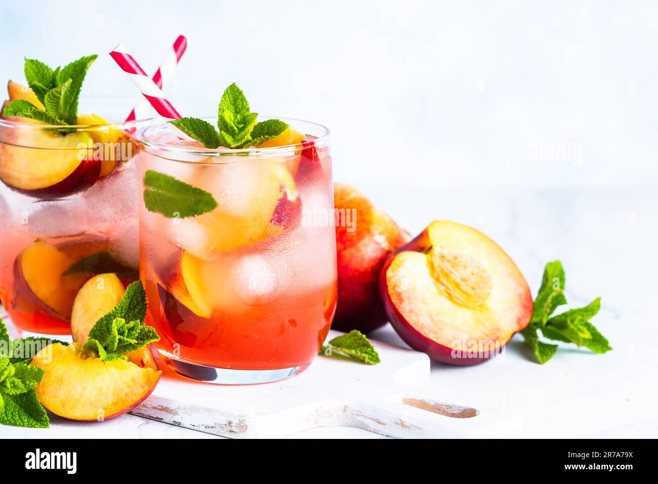 Peach cocktail, iced peach tea, fruit drink Stock Photo - Alamy