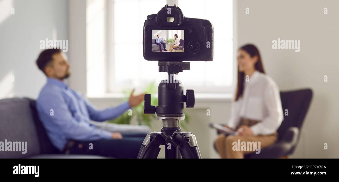 Banner background with close up of digital video camera recording ...