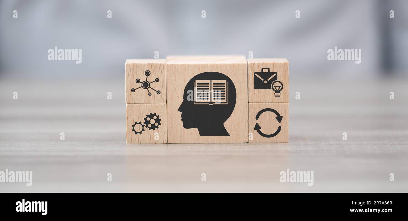 Wooden blocks with symbol of knowledge concept Stock Photo - Alamy