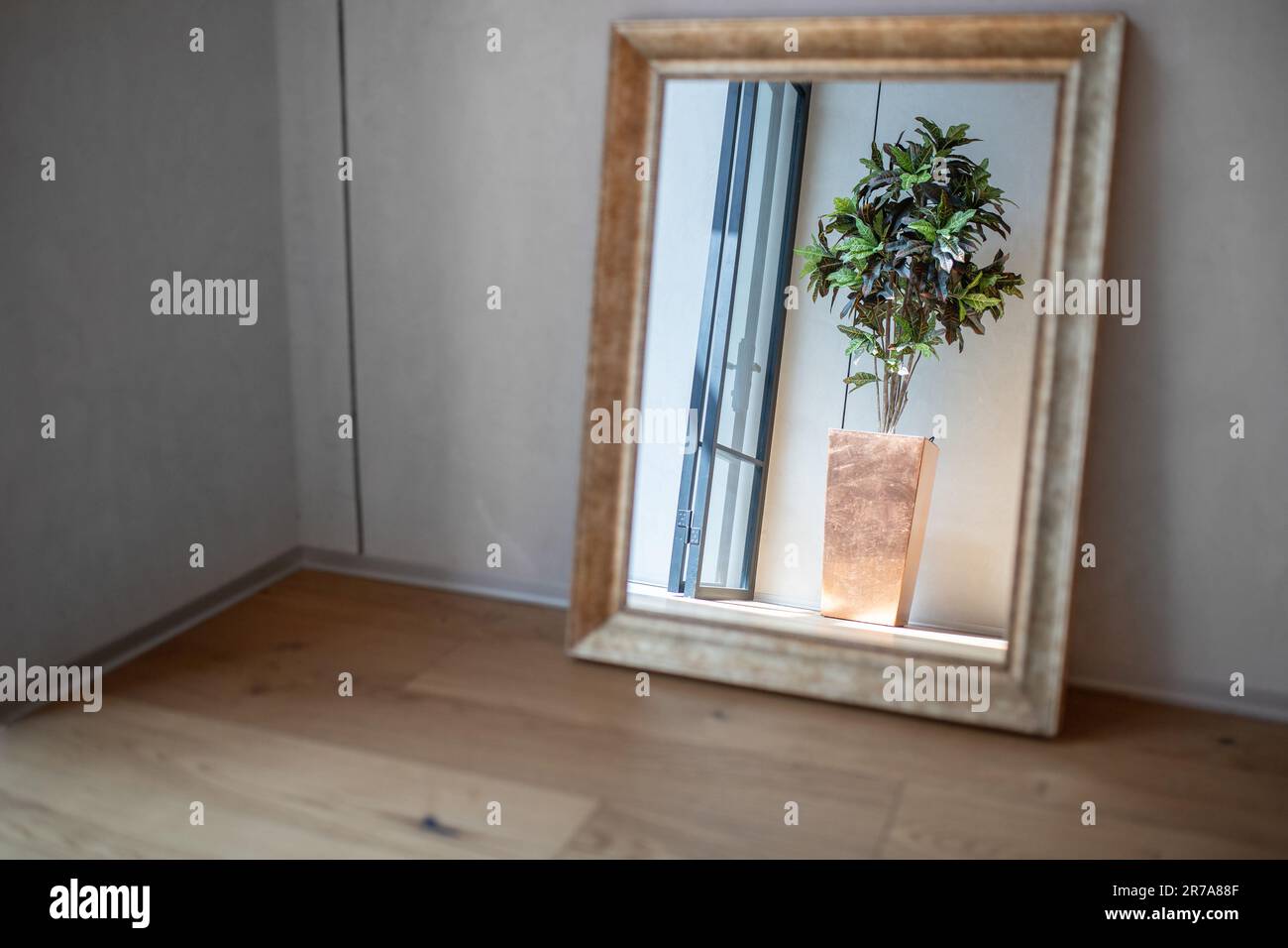 Elegant minimalistic modern interior with a framed mirror on the floor ...