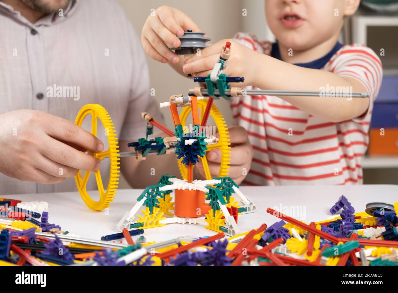 Dad and son build figures from the constructor. Spending time together ...
