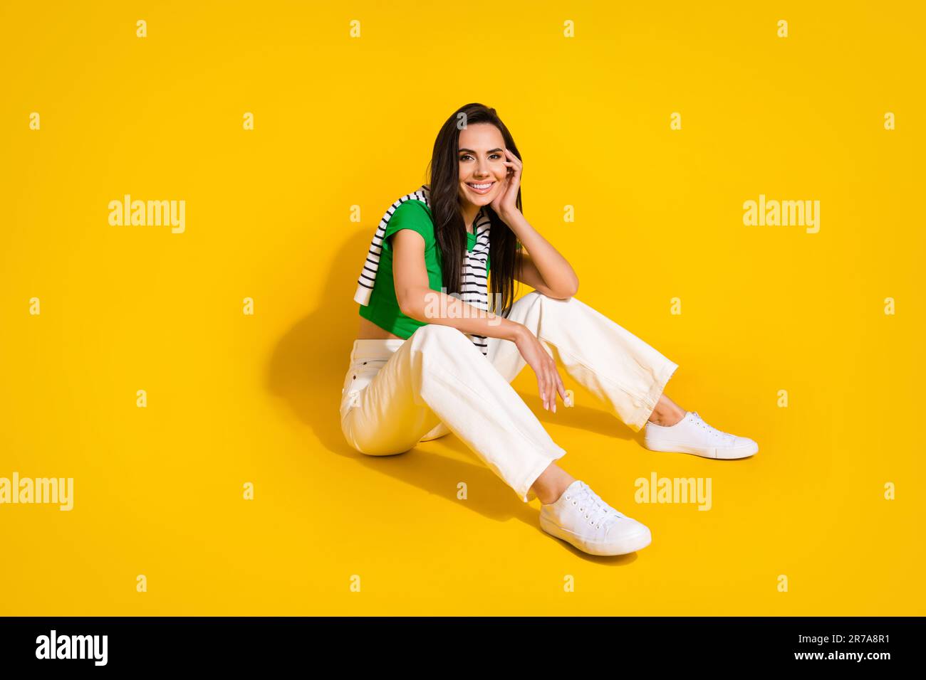 Full length photo of dreamy shiny lady wear white pants hand arm cheek ...
