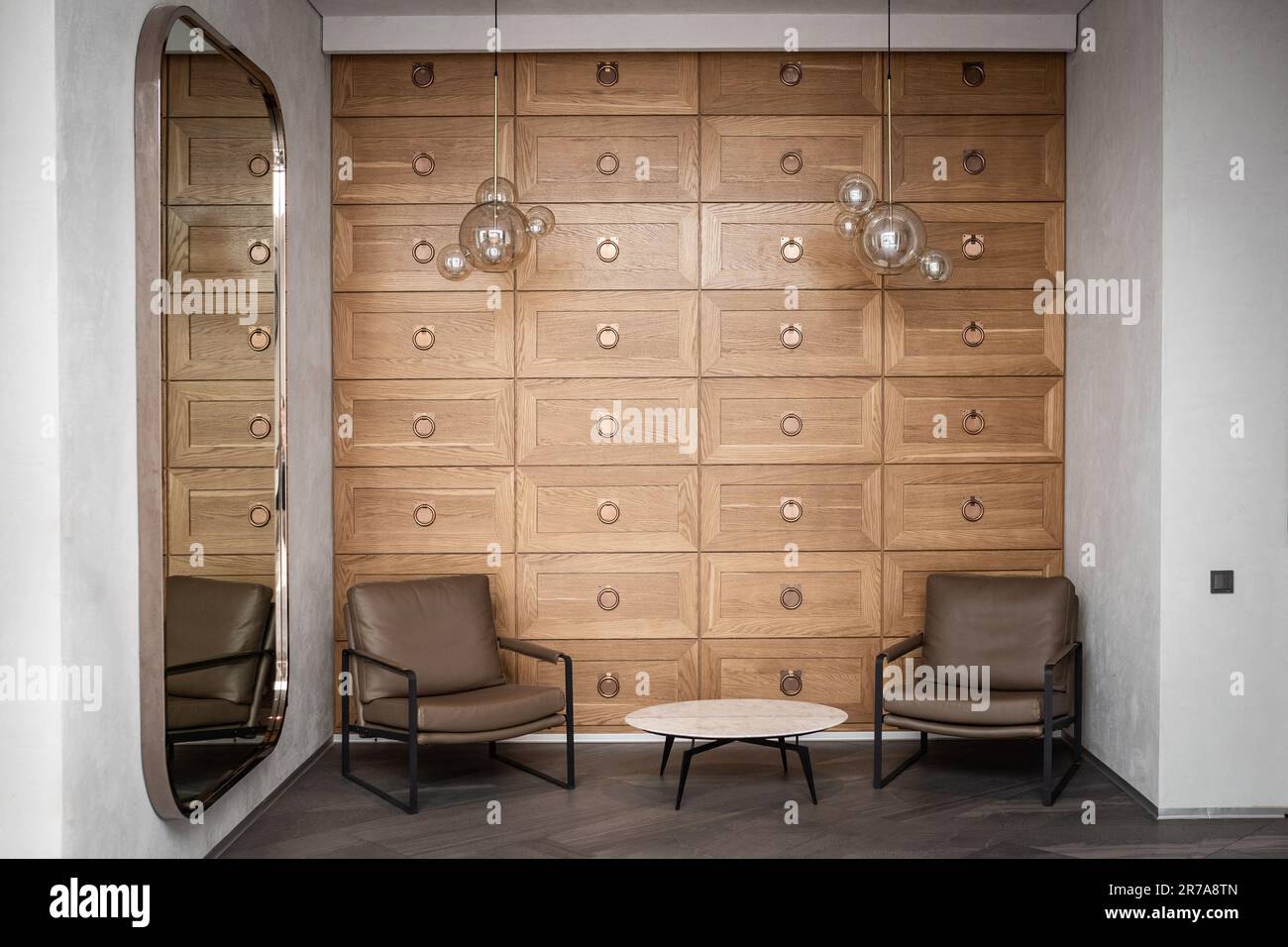 Modern waiting area interior in a mini hotel with a coffee table and ...