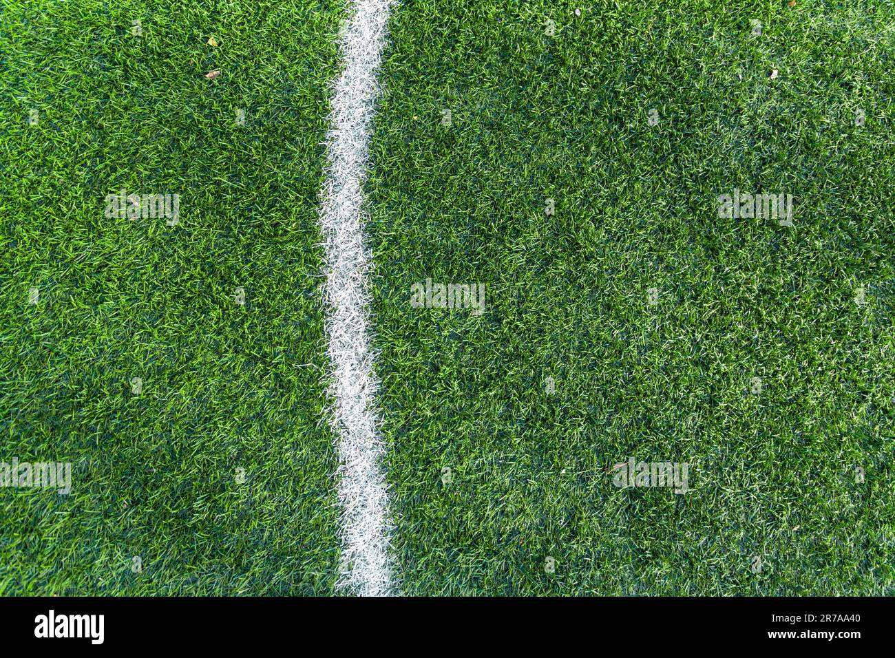 Top view white stripe markings on the green lawn of the sports field ...