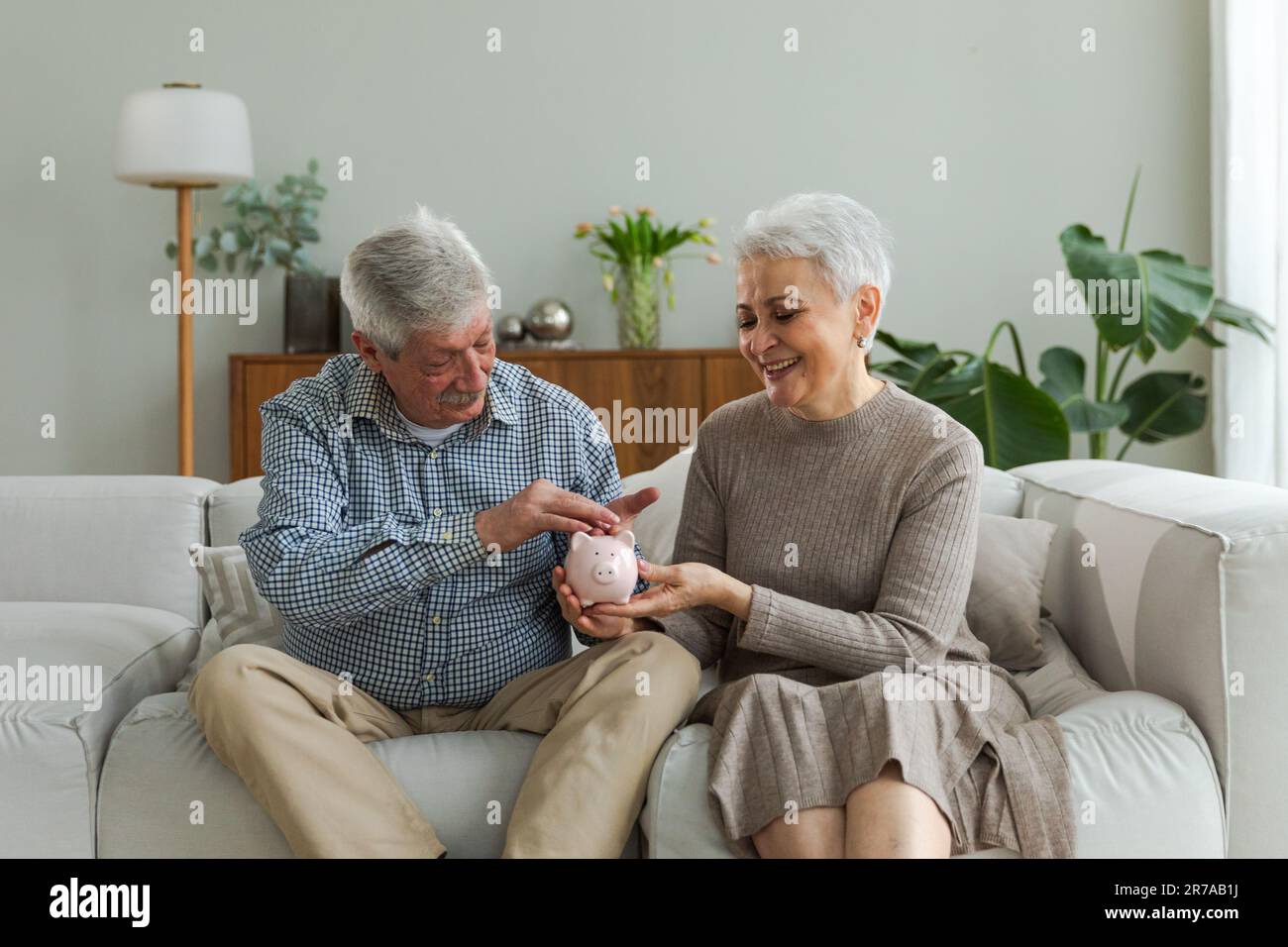 Saving money investment for future. Senior adult mature couple holding ...