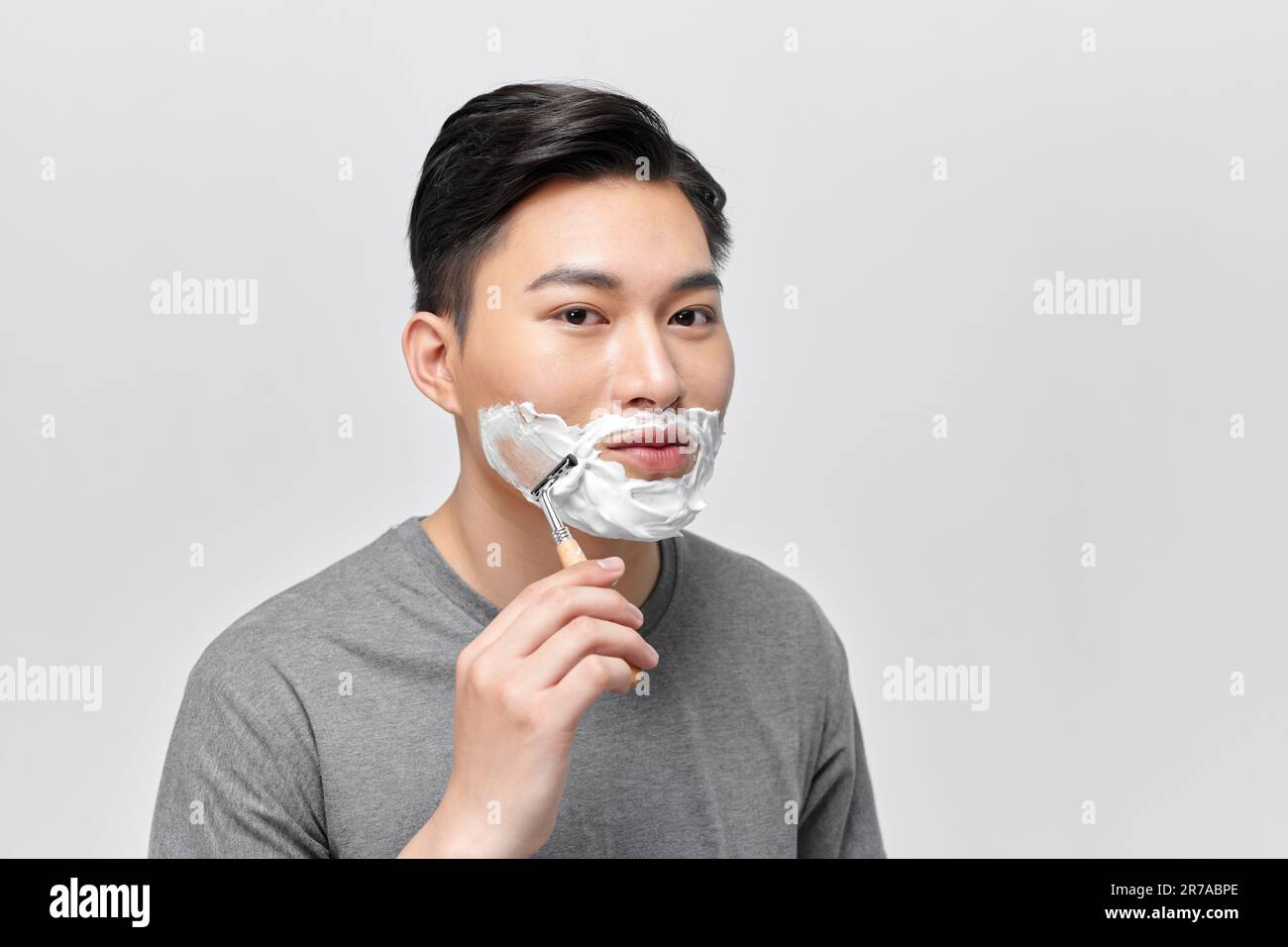 Asian man shaving using razor hi-res stock photography and images - Alamy