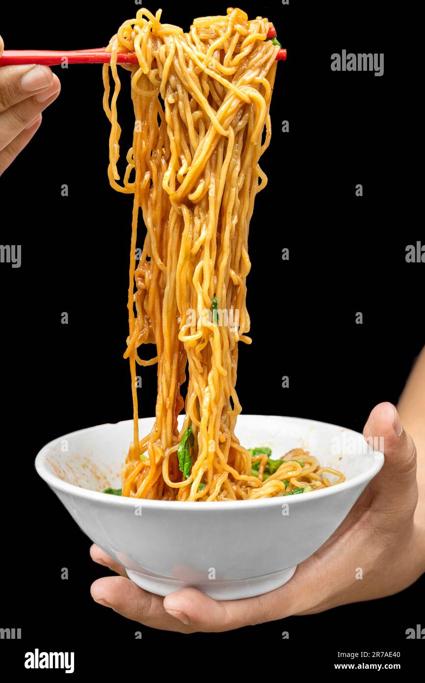 Chicken noodles (Mie Ayam) on black background. Traditional Indonesia ...