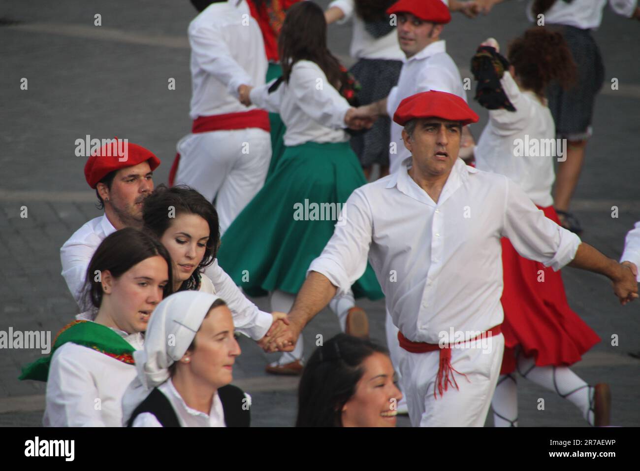 A group of people are celebrating together in a festive environment ...