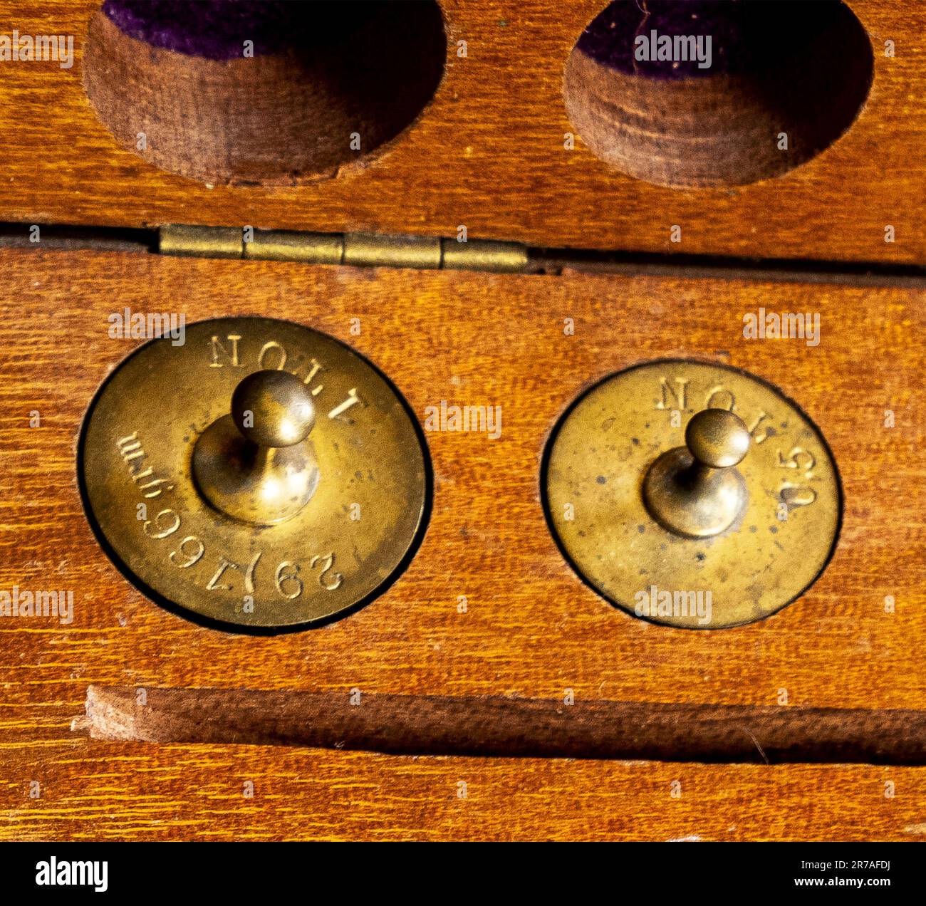 Close up of set of Victorian brass apothecary's weights in mahogany box ...