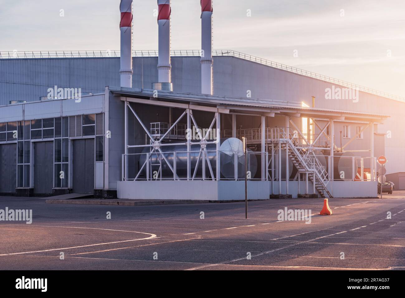 Exterior of the warehouse boiler room at sunset Stock Photo - Alamy