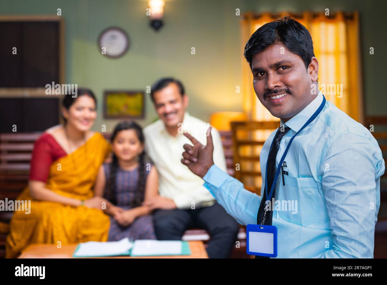 Confident indian banker pointing finger by looking camera in front on ...