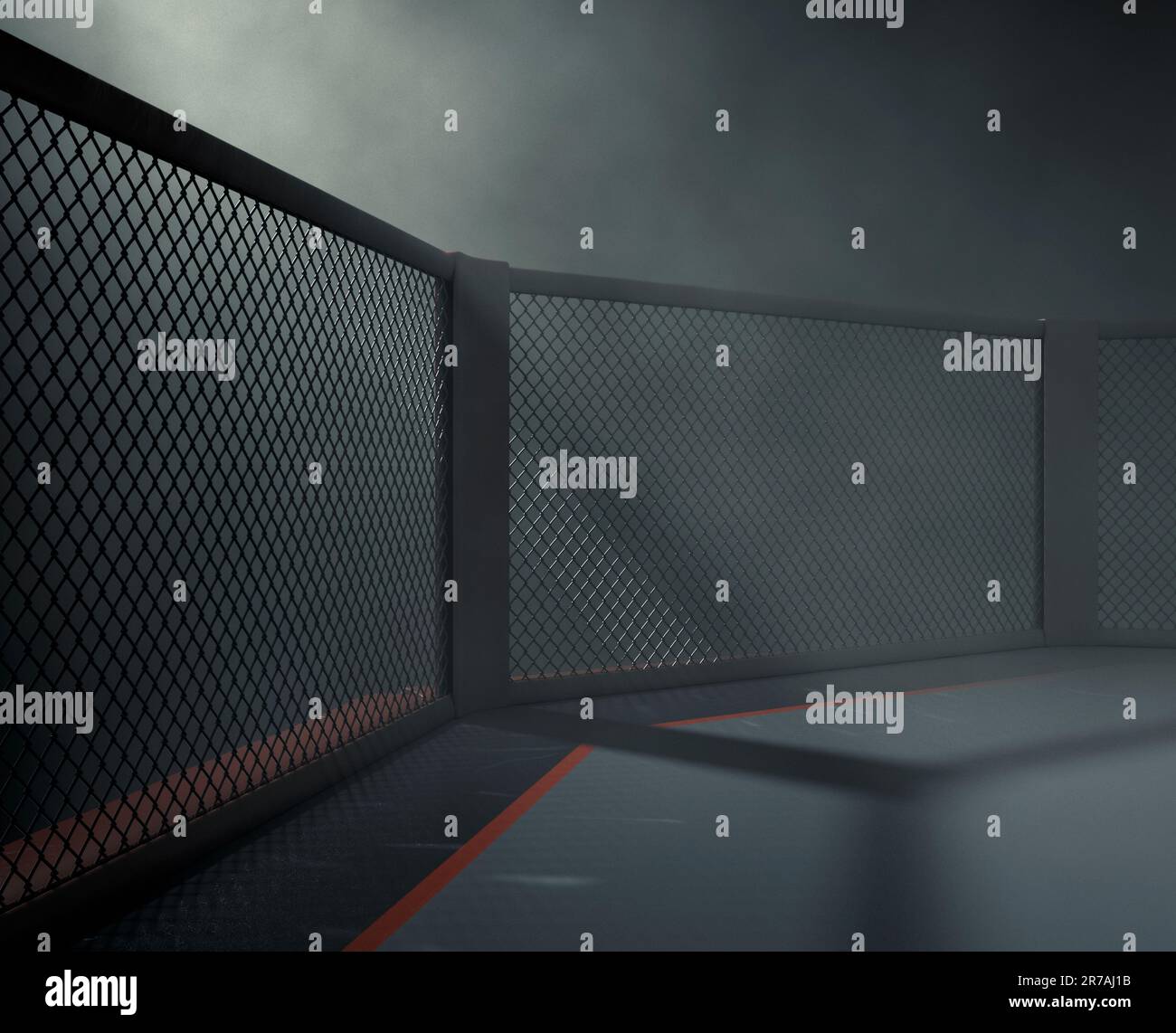 A dimly spotlit section of a mma octagon ring surrounded by wire mesh ...