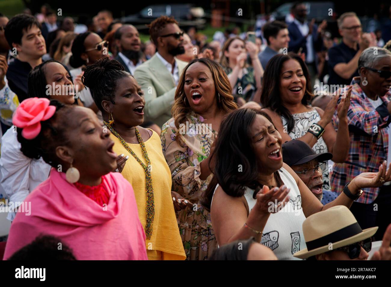 Attendees react to a performance from Broadway Inspirational Voices ...