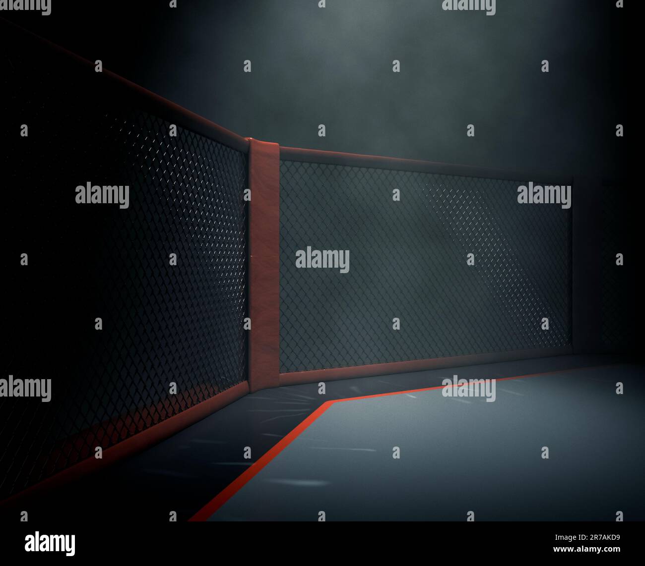 A dimly spotlit section of a mma octagon ring surrounded by wire mesh ...