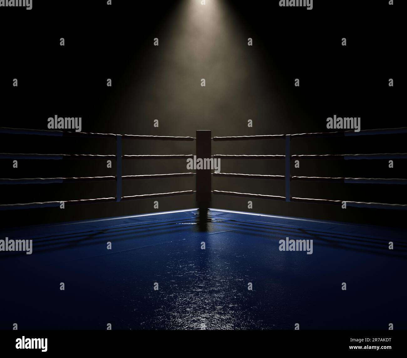 A dimly spotlit corner of a boxing ring surrounded by ropes on a dark ...
