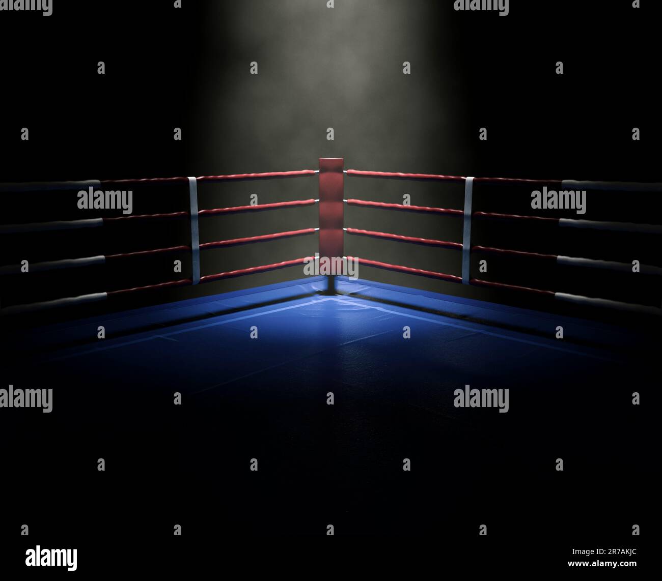 A dimly spotlit corner of a boxing ring surrounded by ropes on a dark ...