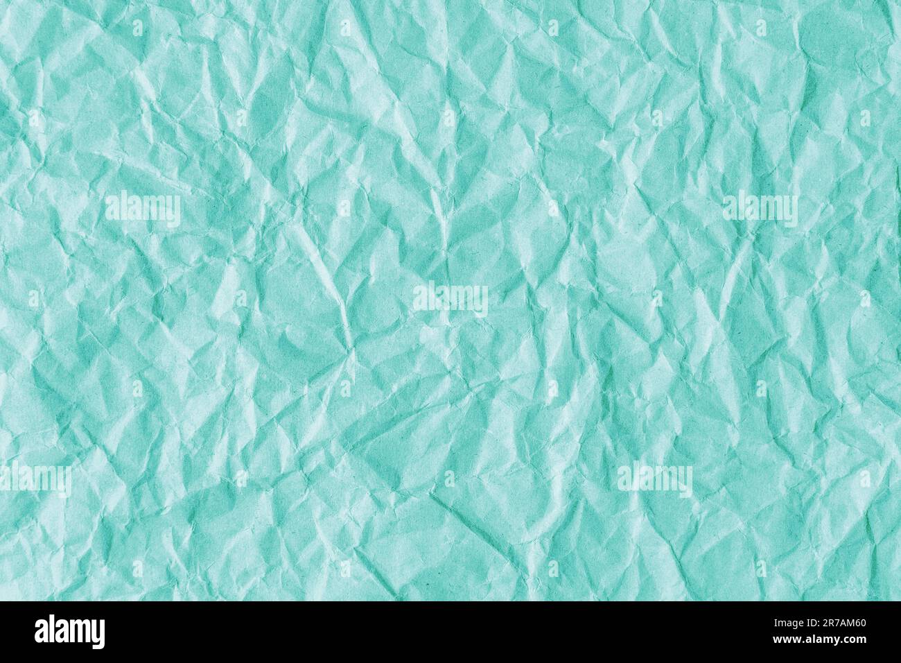 Recycled crumpled turquoise paper texture background. Wrinkled and ...