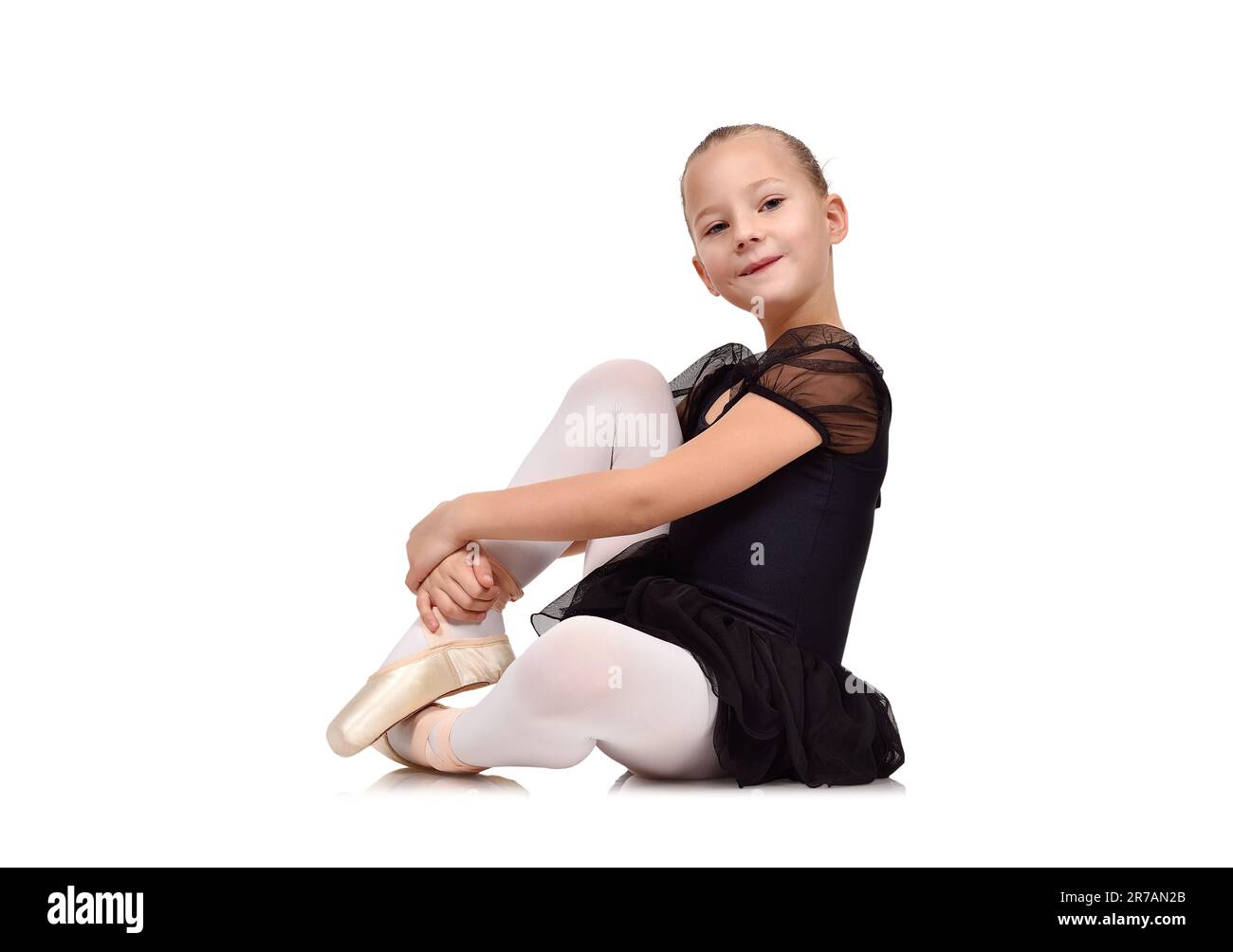 little ballerina sitting on floor in black tutu Stock Photo - Alamy