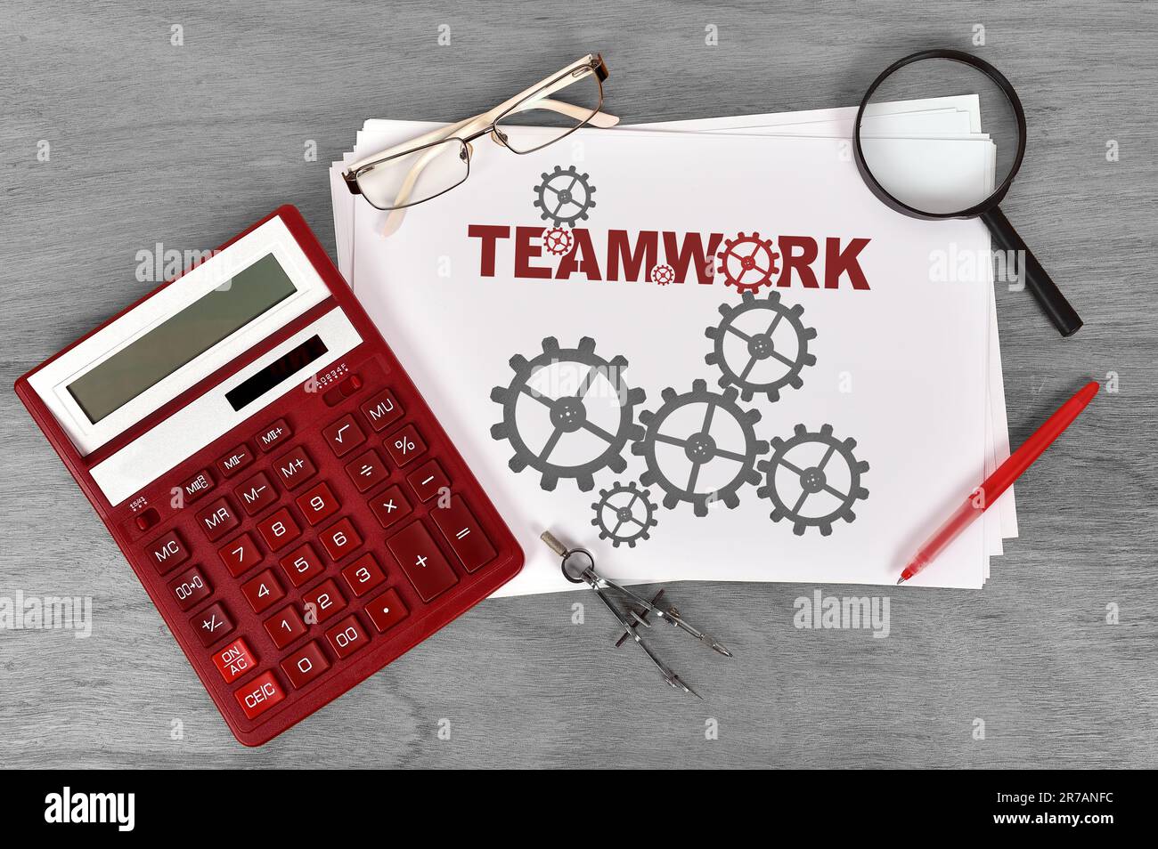 Blank paper with calculator, pen, glasses and magnifying glass ...