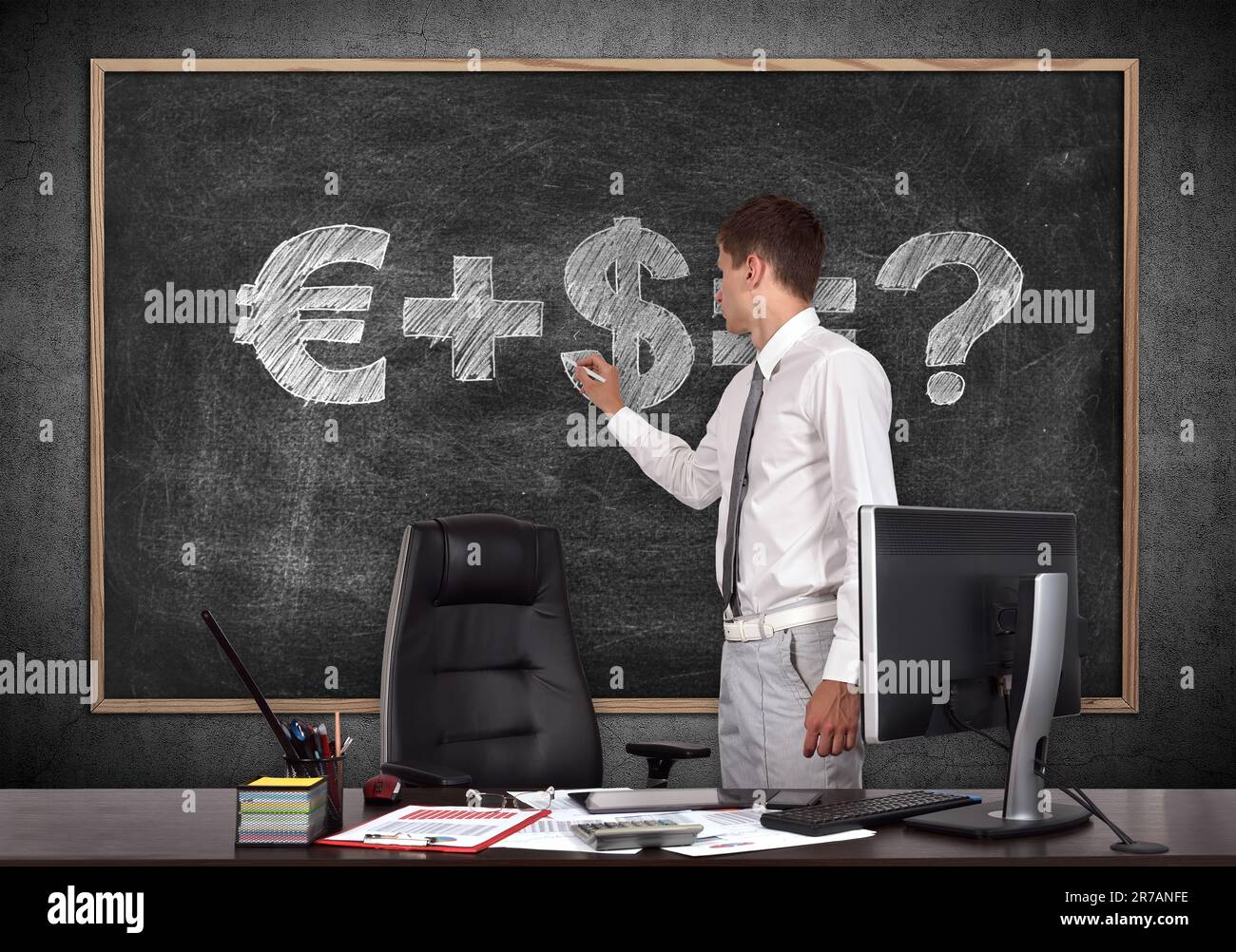 businessman in office drawing money formula on blackboard Stock Photo ...