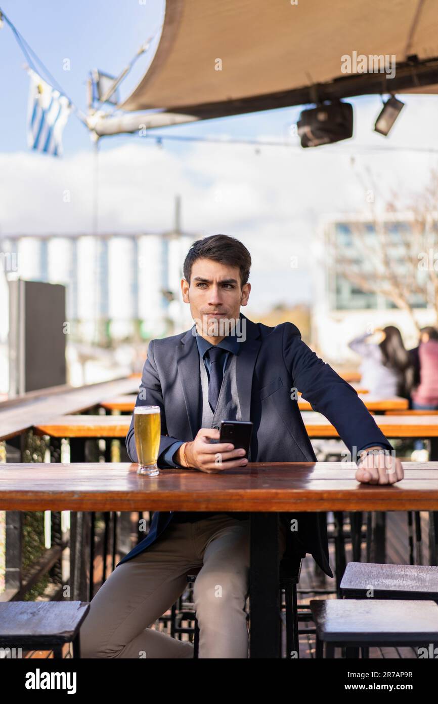 Man thinking something after checking his smartphone Stock Photo - Alamy