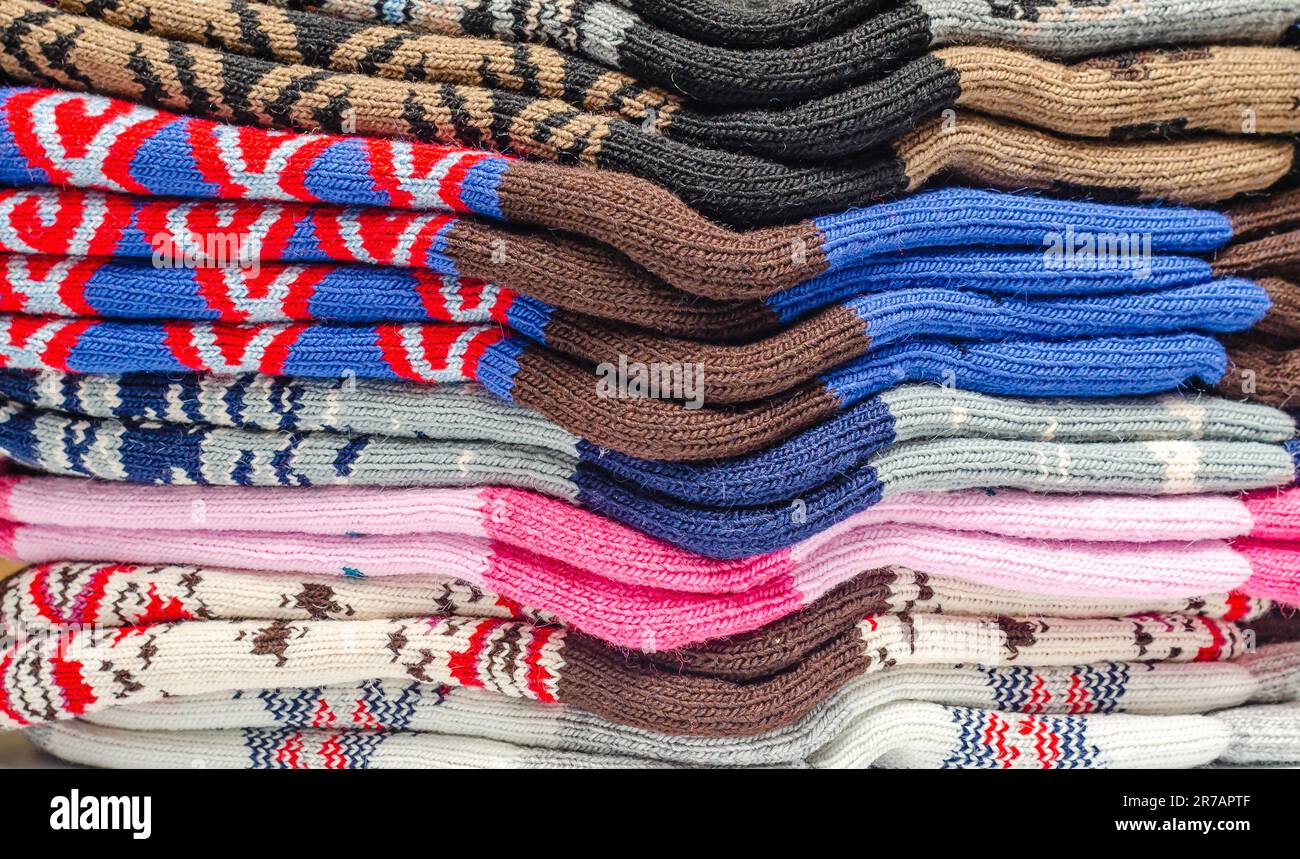 Stack of warm wool winter socks of different colors and patterns Stock ...