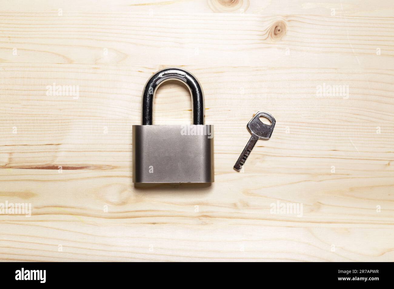 check-lock on the wooden table background Stock Photo - Alamy